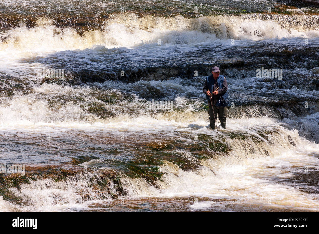Man wading through water hi-res stock photography and images - Alamy