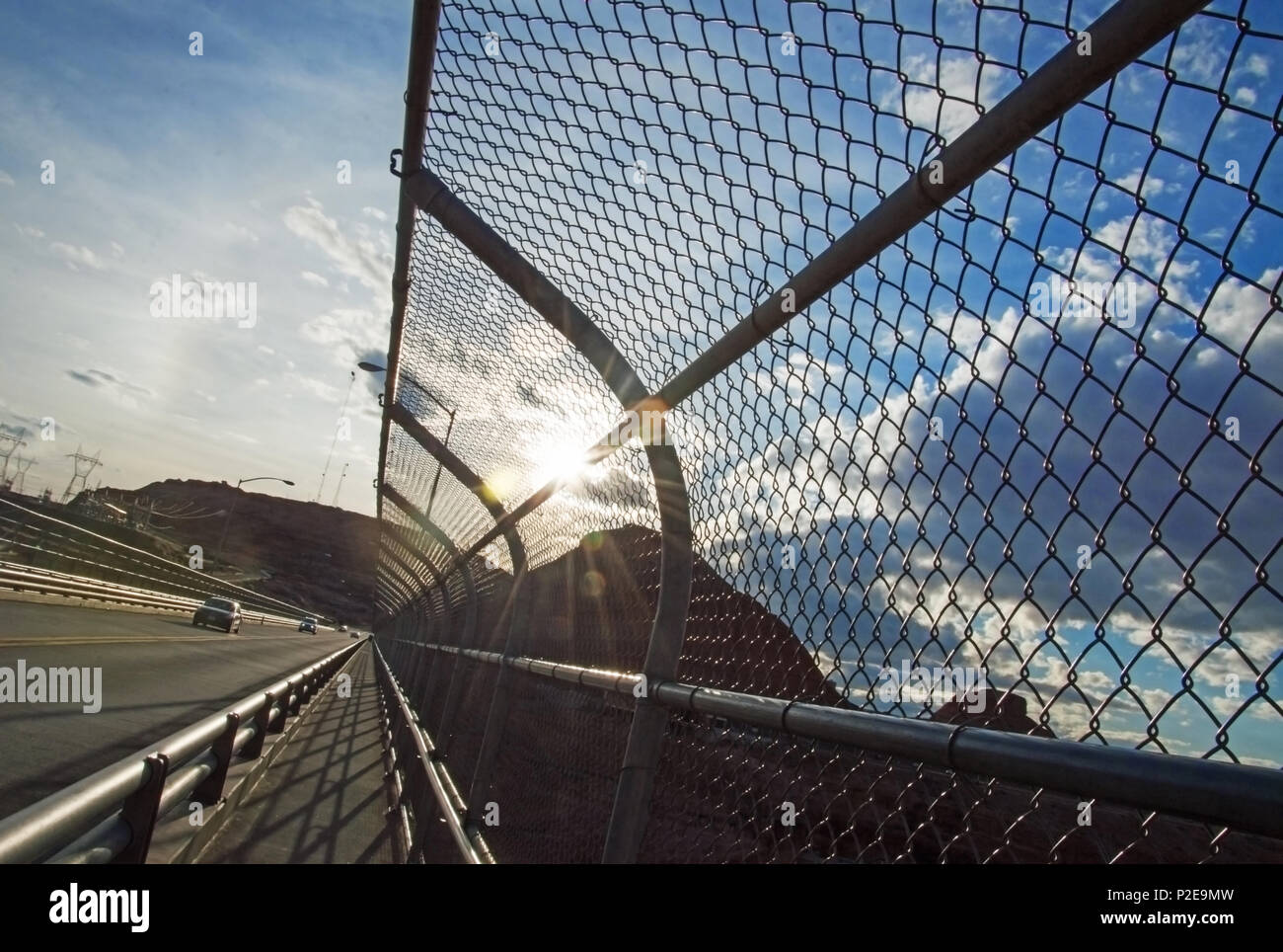 Sunlight coming through a bridge guardrail walking path at sunset Stock ...