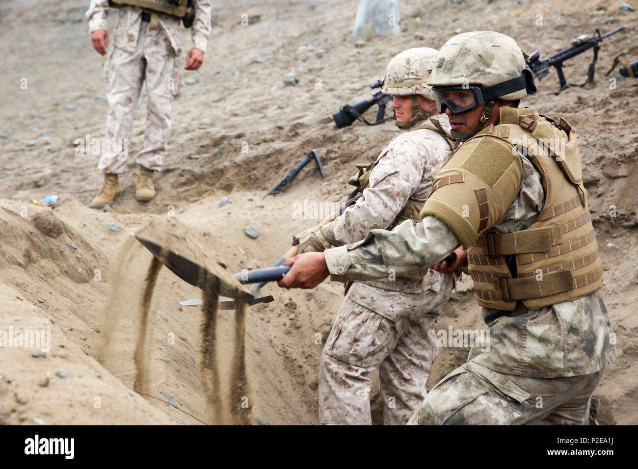 A Peruvian Marine works together with U.S. Marines and sailors from ...