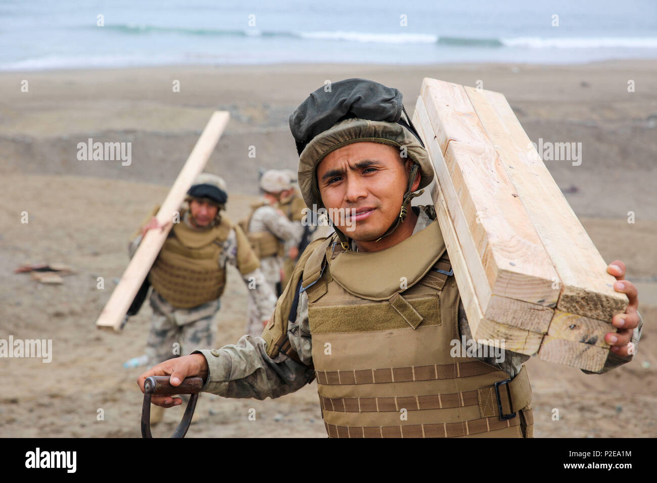 Peruvian Marines carry gear and equipment for a fighting position class ...