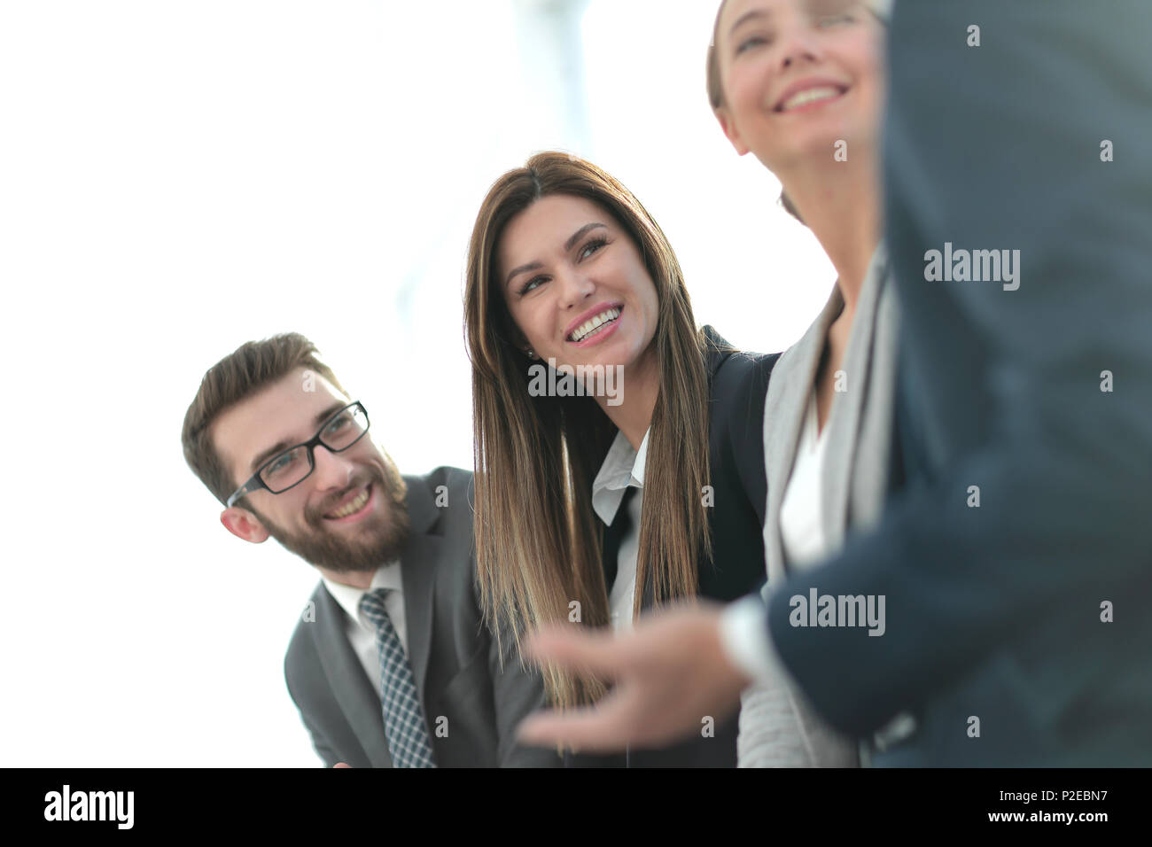 close up.successful employees listen to their boss Stock Photo - Alamy