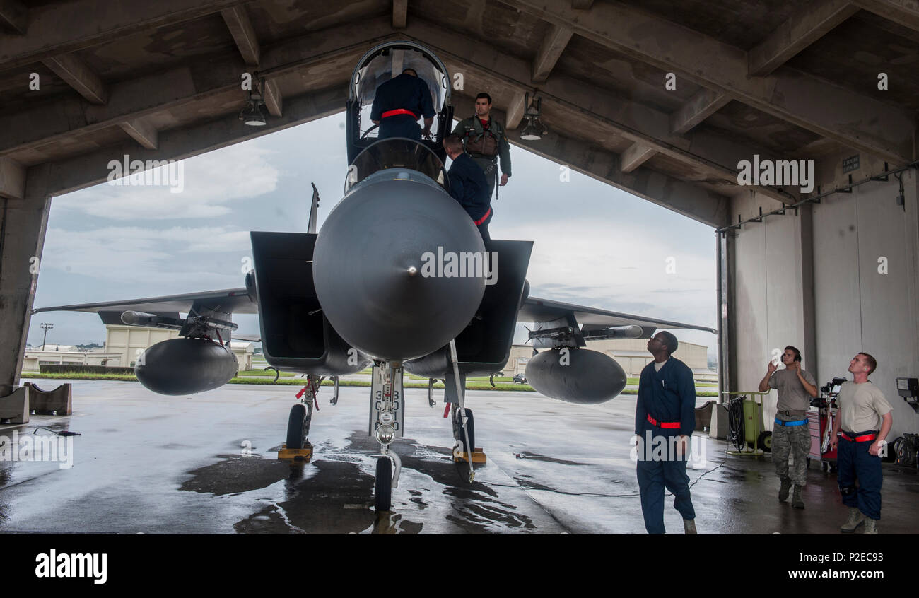 Airmen from the 18th Aircraft Maintenance Squadron prepare an F-15 ...