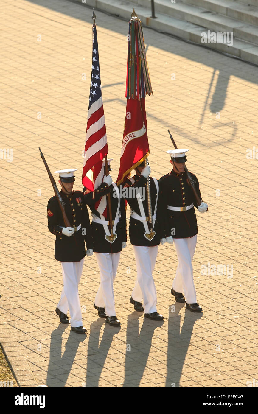 Marines march on the colors during an opening ceremony of Marine Week ...