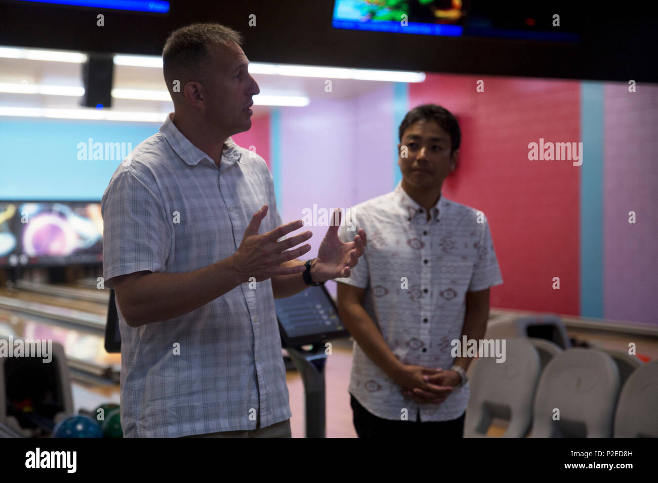 Col. Brian M. Howlett and Takayuki Kayo greet guests of the 22nd Annual ...