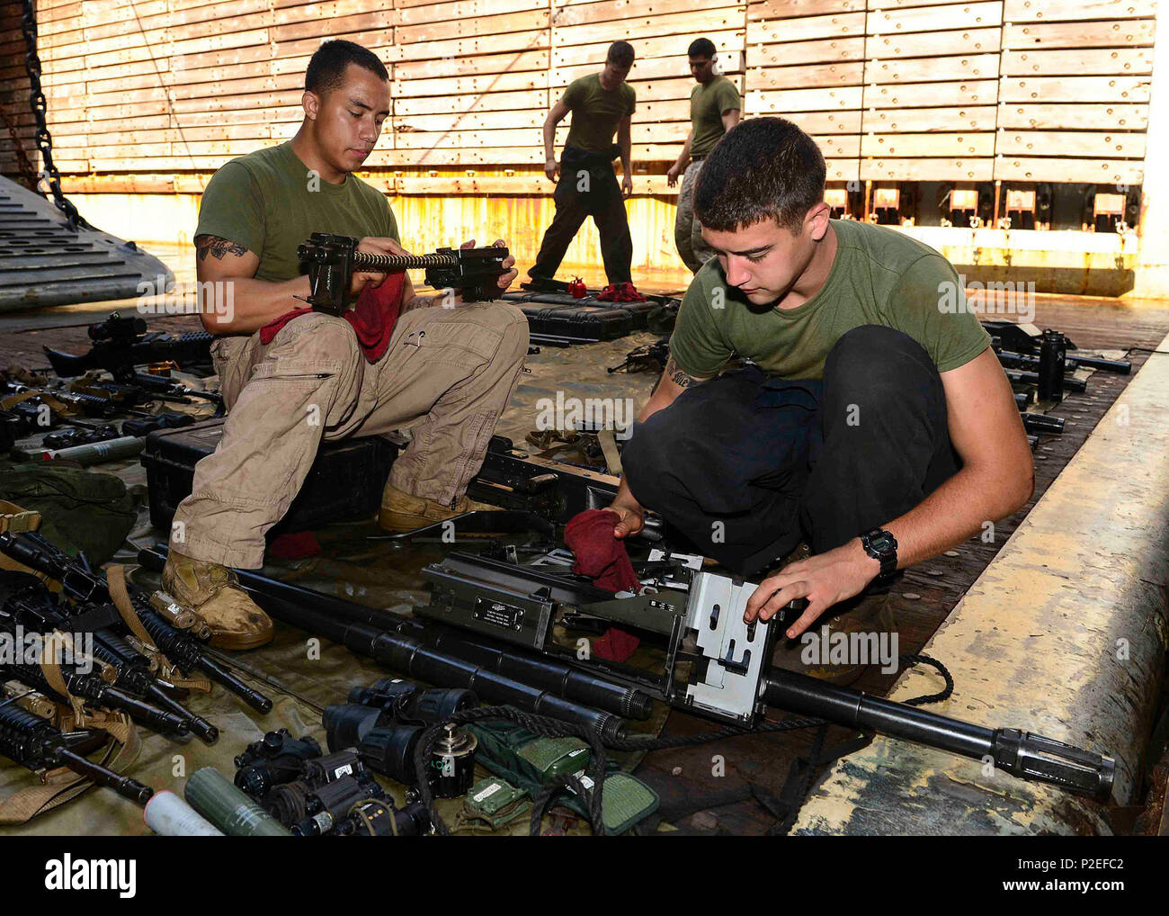 160912-N-TI017-056 GULF OF ADEN (Sept. 12, 2016) Marines clean an MK19 ...