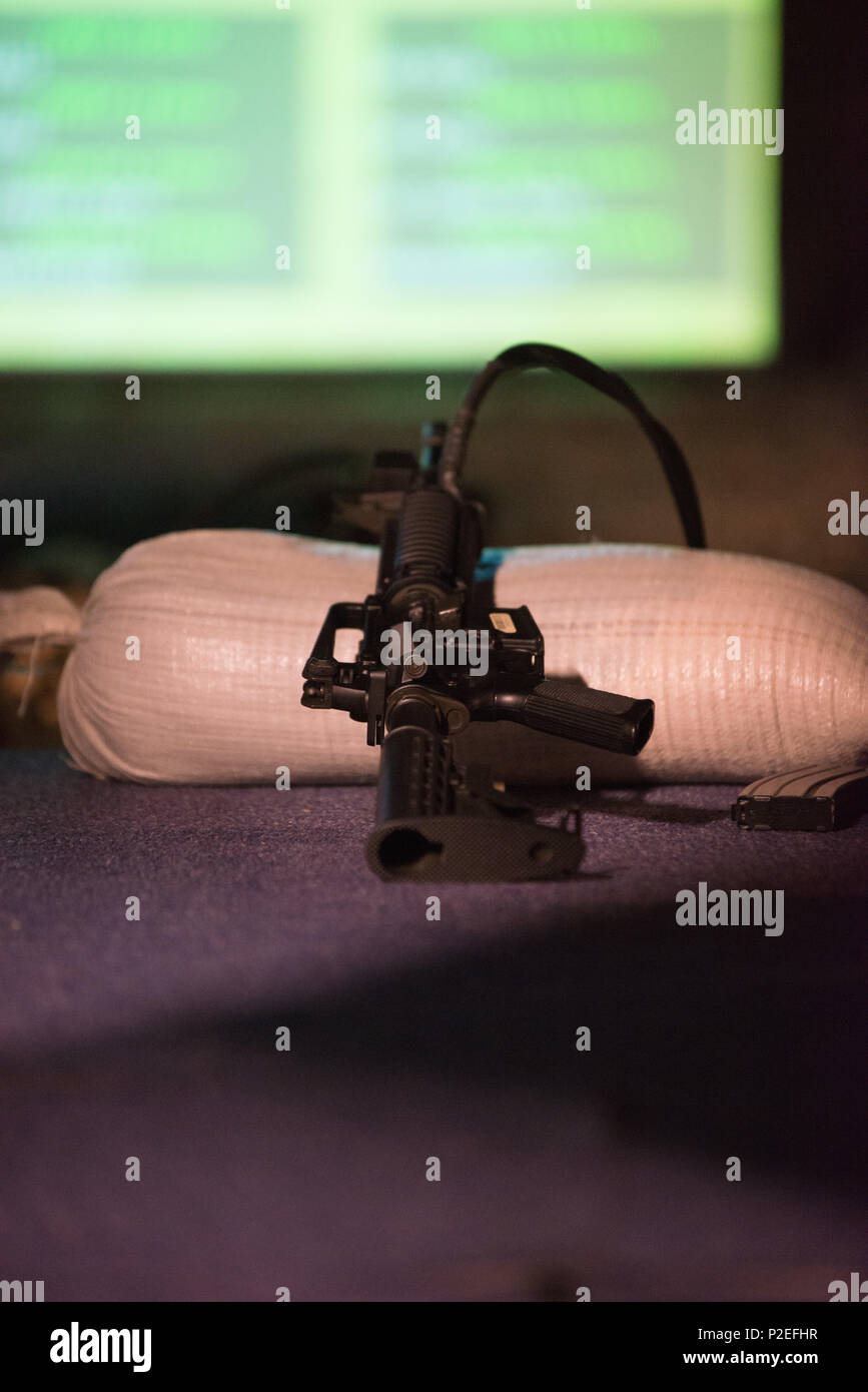 View of an M16 rifle connected to the Engagement Skills Trainer during ...