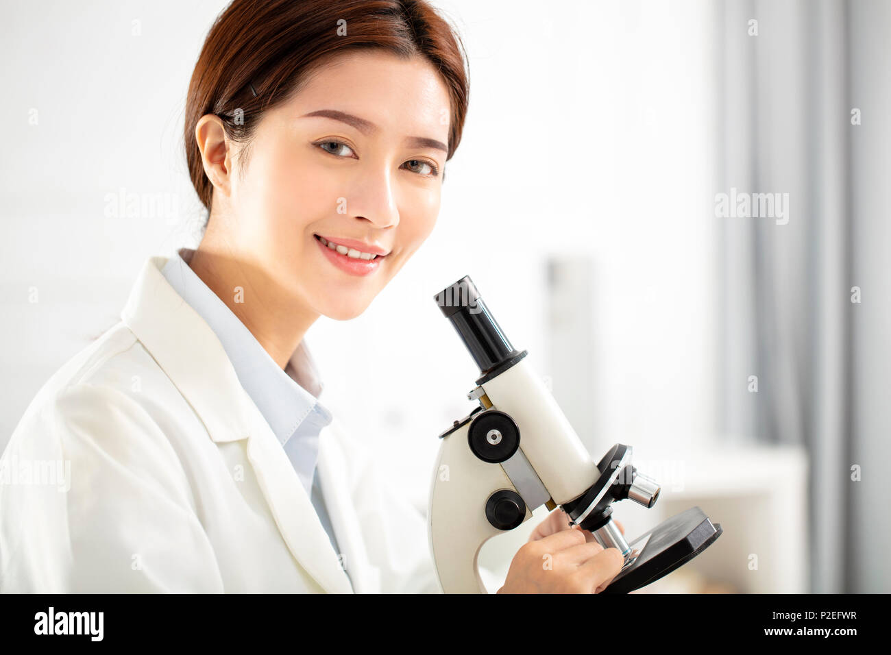female medical or scientific researcher working in office Stock Photo ...