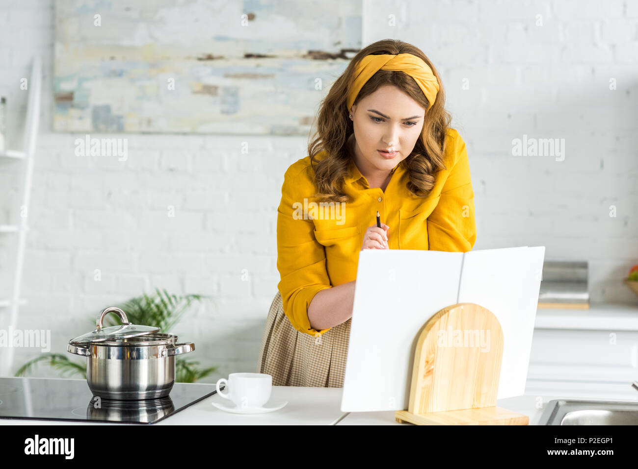 Reading recipe book hi-res stock photography and images - Alamy