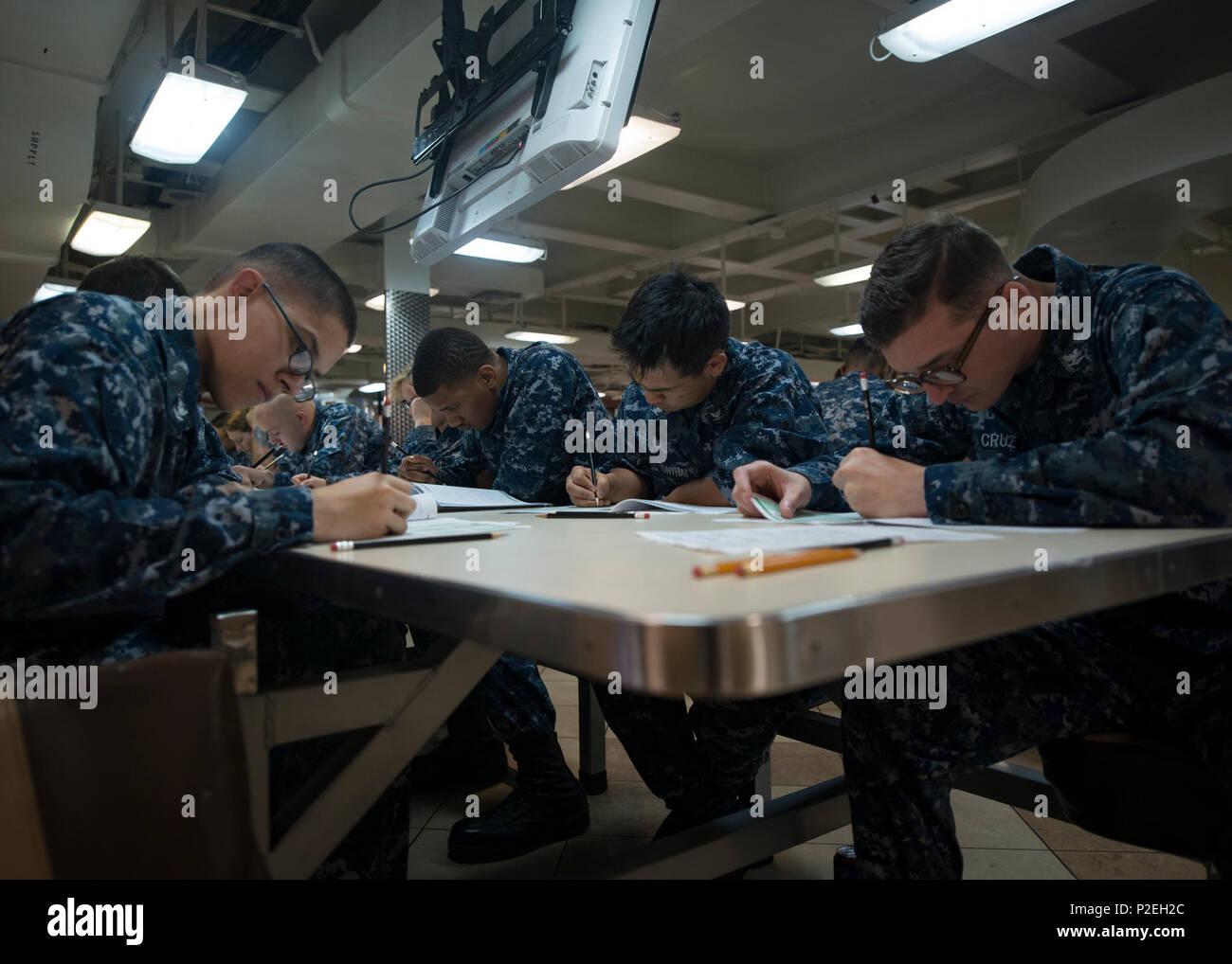 Service members aboard the nuclear‑powered aircraft carrier USS Carl ...