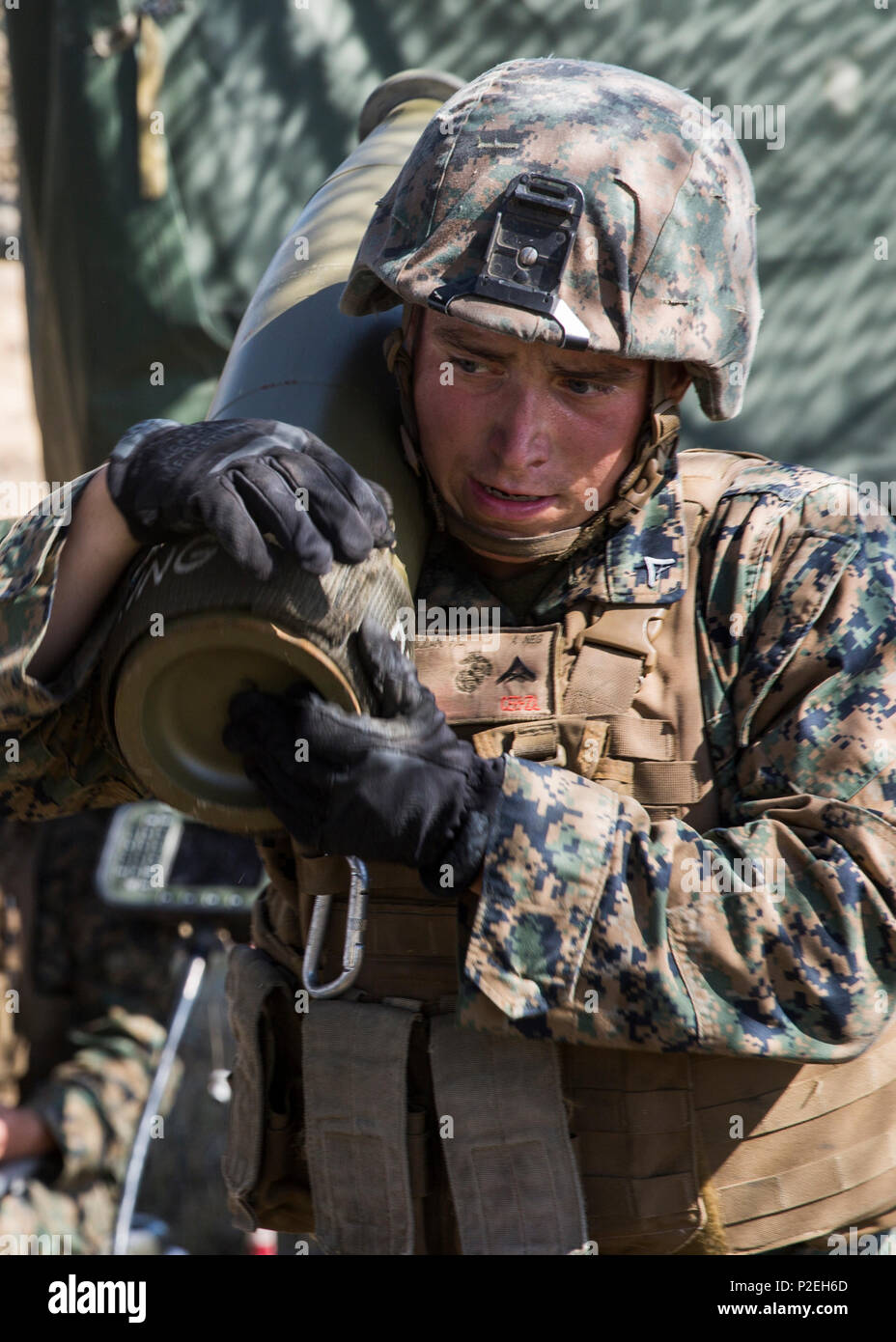 U.S. Marines fire artillery rounds from their respective positions ...