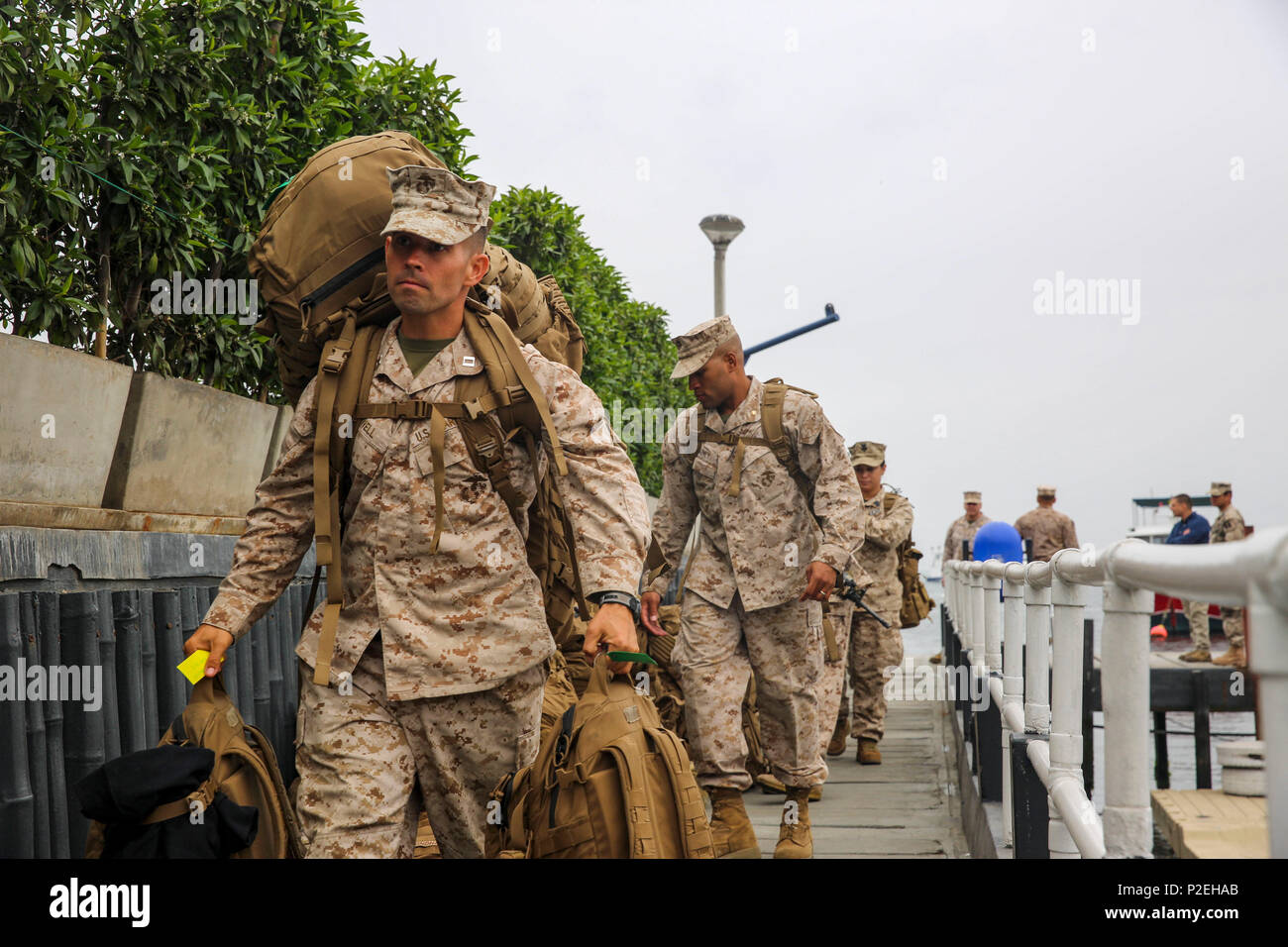 U.S. Marines with Task Force Koa Moana unload gear after arriving in ...