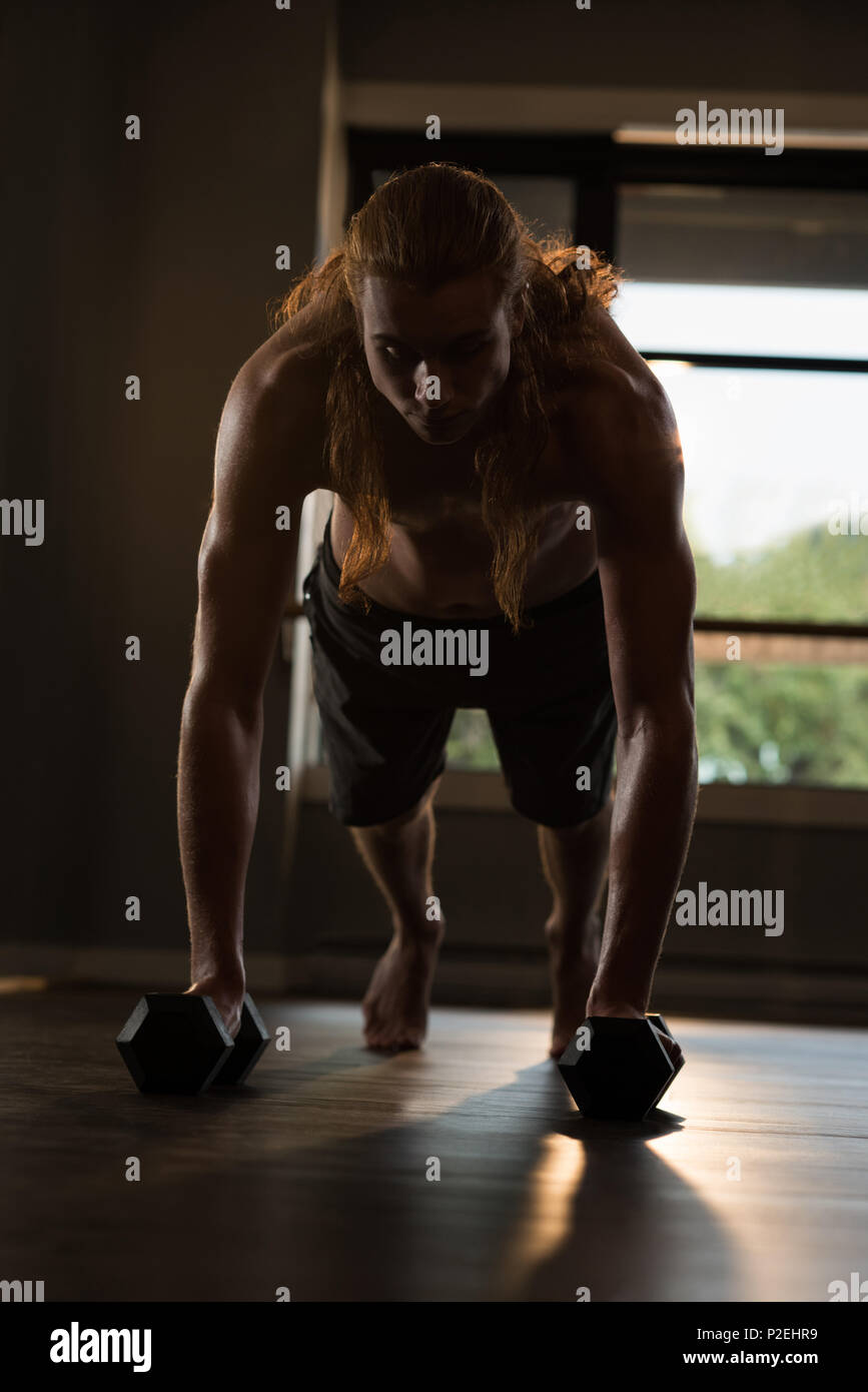 Athlete doing exercise dumbbells hi-res stock photography and images ...