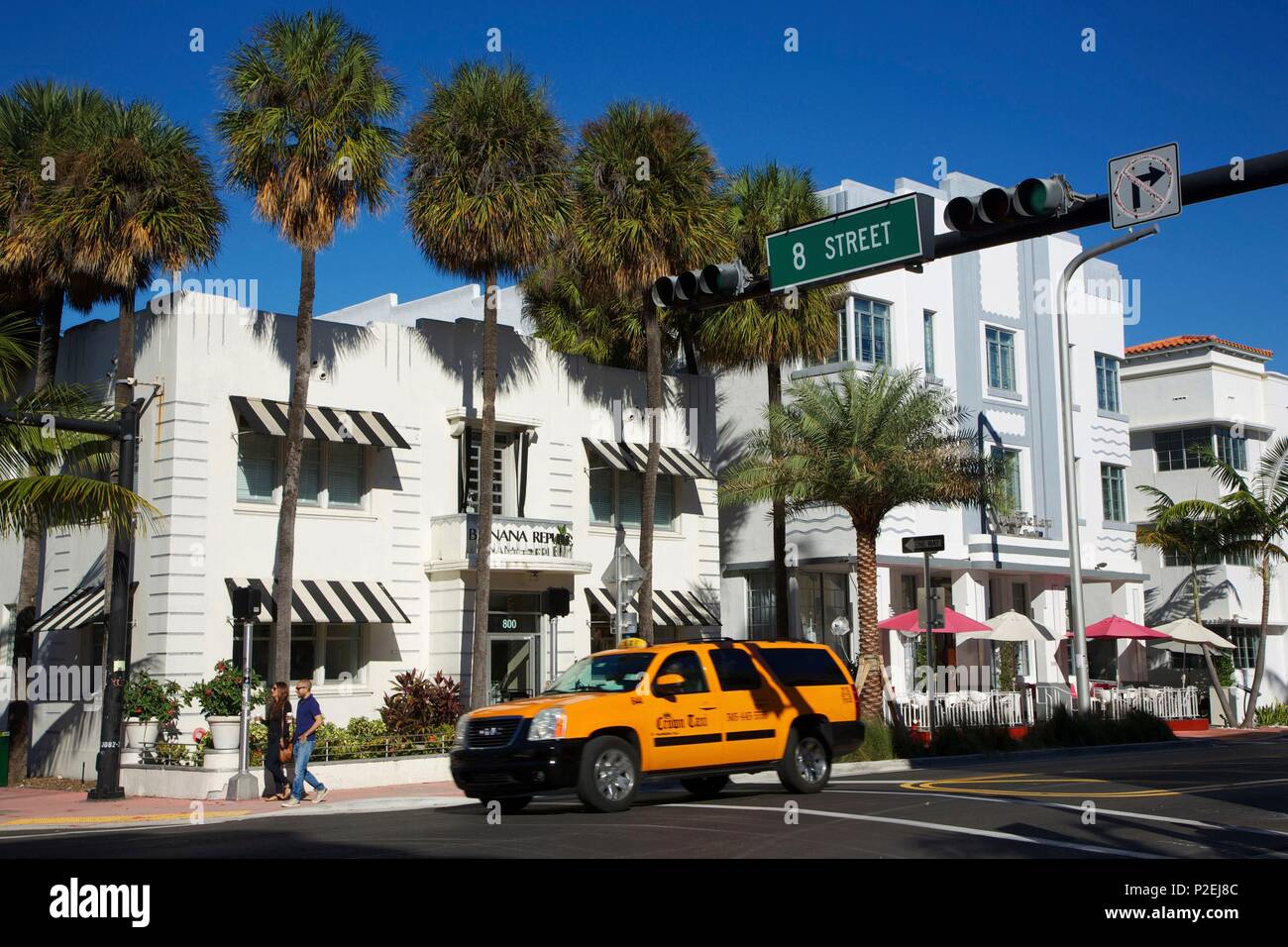 United States, Florida, Miami, Yellow cab passing in front of Art Deco ...