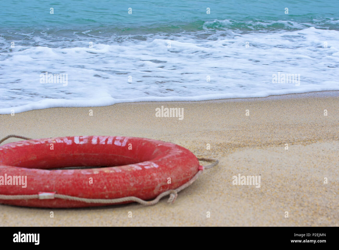 Lifebuoy on the beach. Concept of saving lives Stock Photo - Alamy