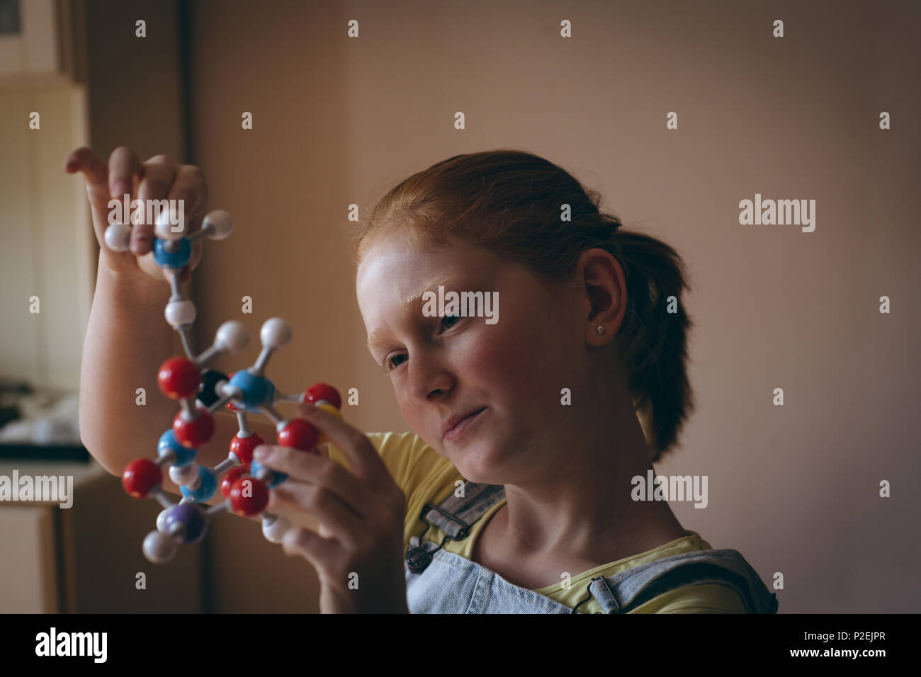 Girl experimenting with molecule Stock Photo - Alamy