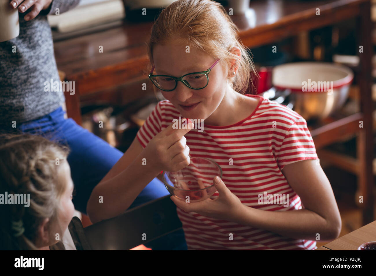Girl having a snack Stock Photo - Alamy