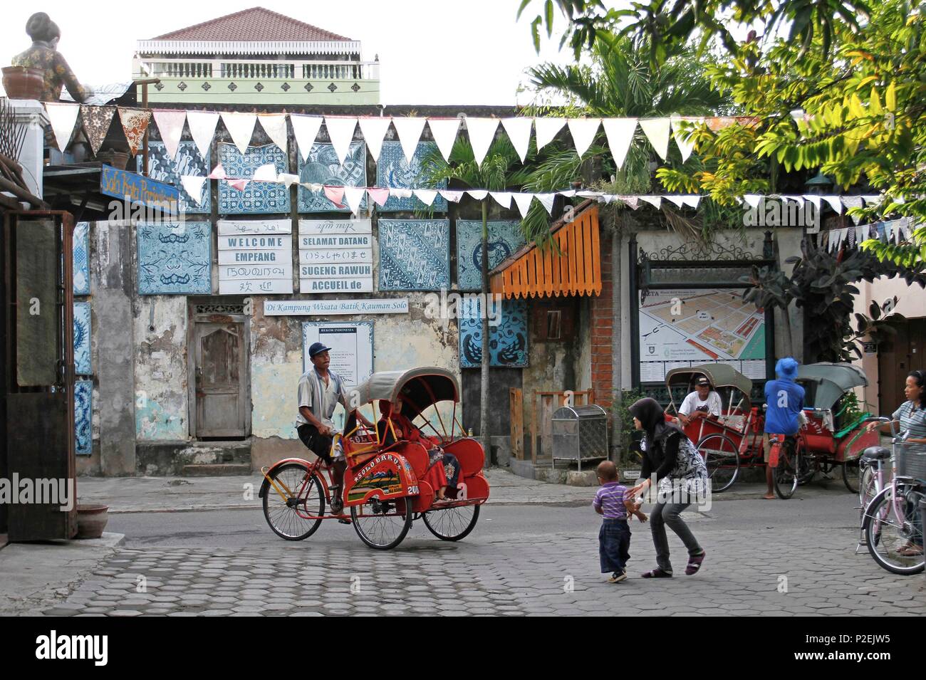 Indonesia, Java, Solo, Bicle rickshaw in an alley of the olf town Stock ...