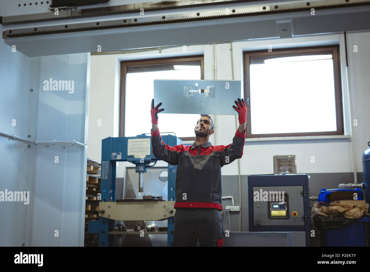Male worker checking a machine board Stock Photo - Alamy