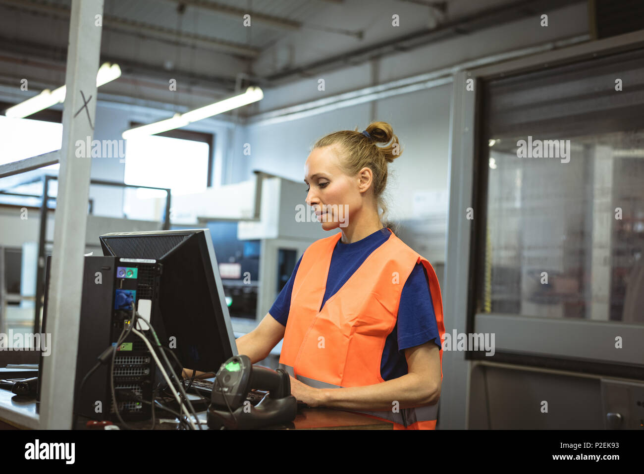 Female working on computer Stock Photo - Alamy
