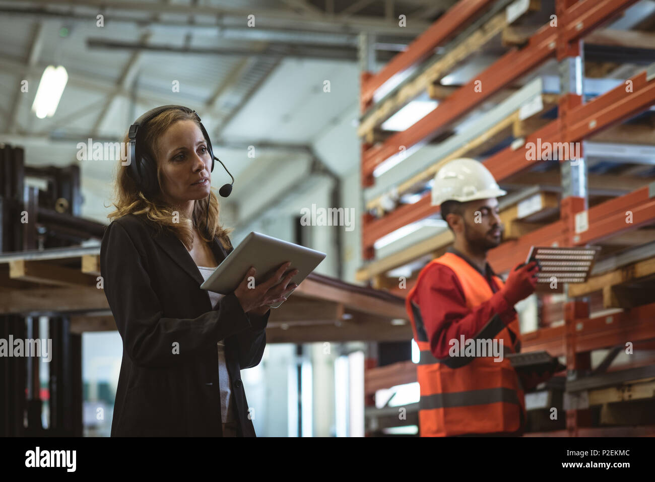 Female worker using digital tablet Stock Photo - Alamy