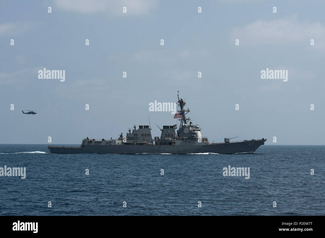 USS Mason (DDG 87), conducts divisional tactic maneuvers as part of a ...