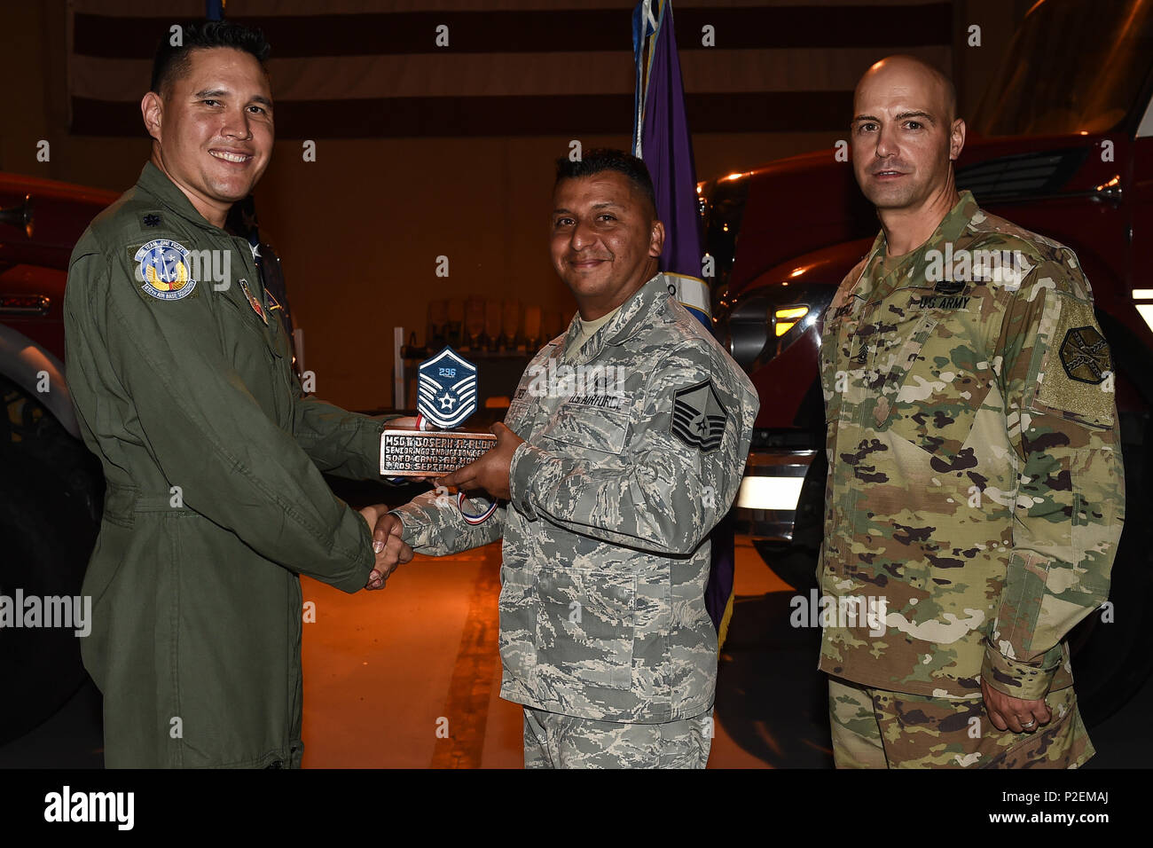 U.S. Air Force Master Sgt. Joseph A. Flores (center), 612th Air Base ...