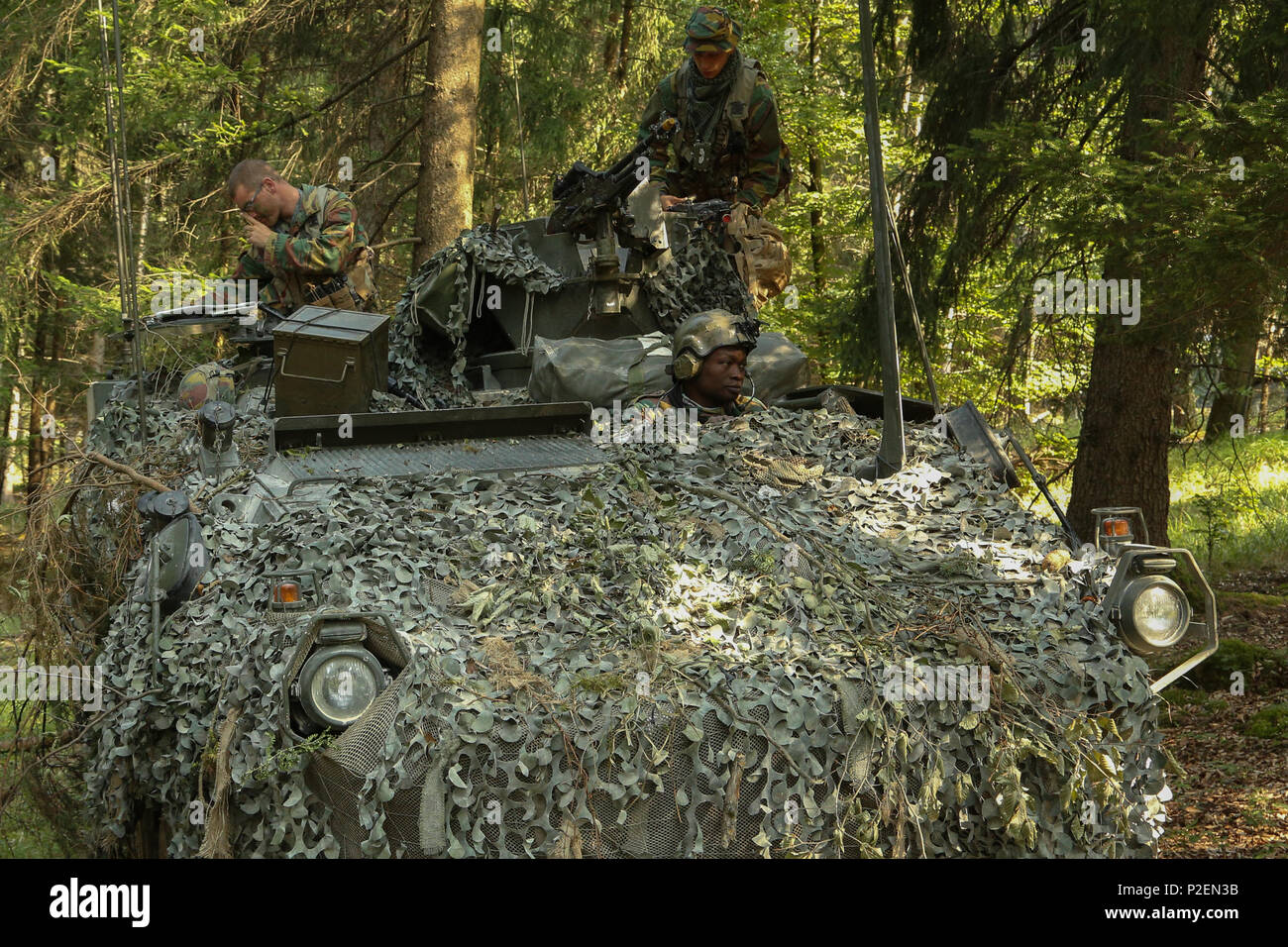 Belgian soldiers perform pre-combat checks on their Pandur armored ...