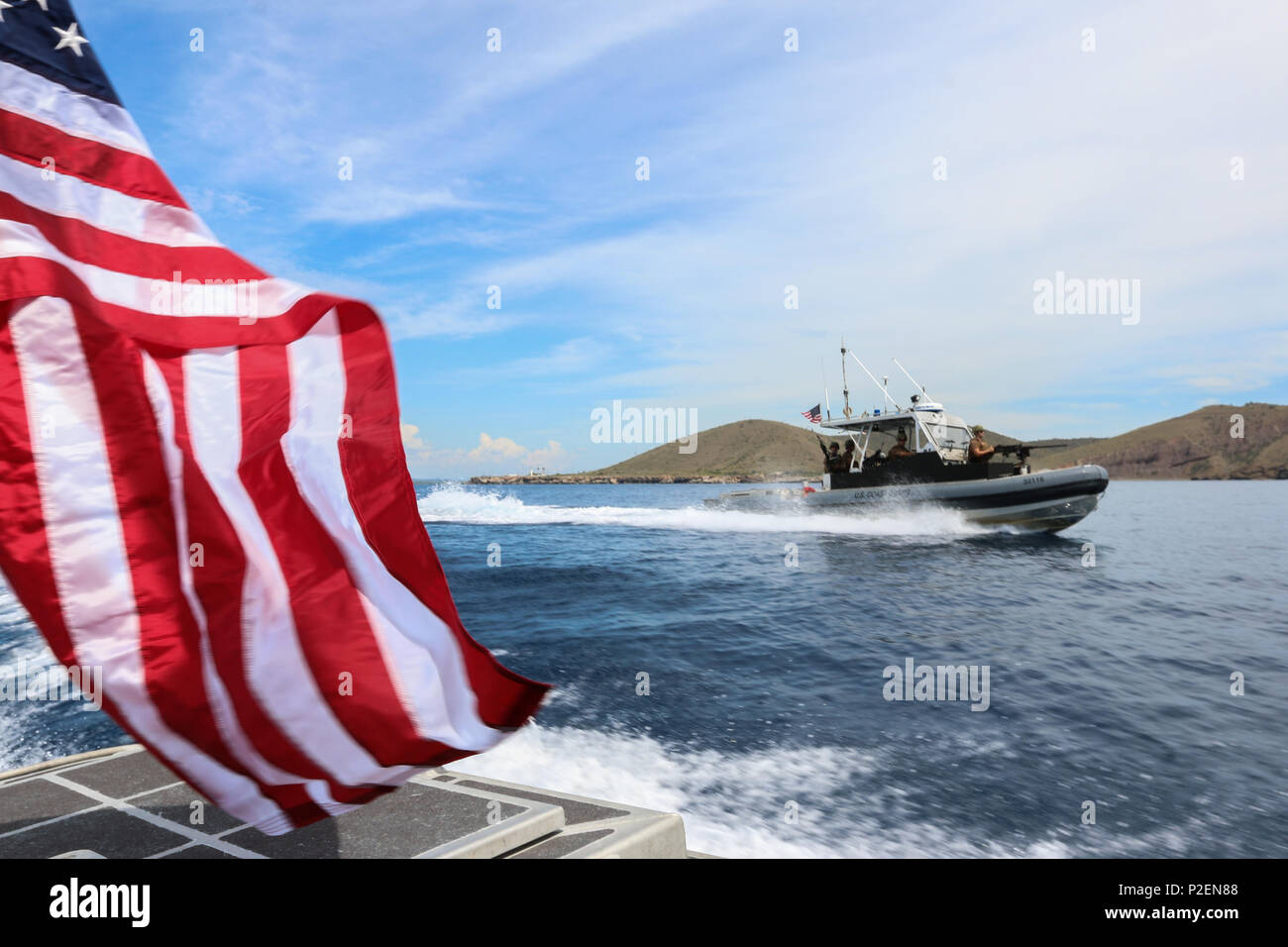 Coast Guardsmen aboard a Transportable Port Security Boat glide across ...