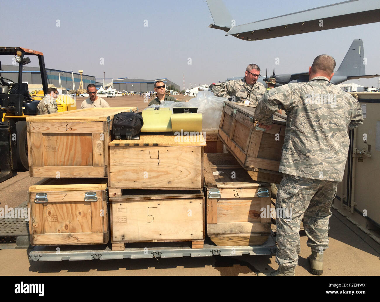 Airmen from the New York Air National Guard unload the MQ-9 Reaper from ...