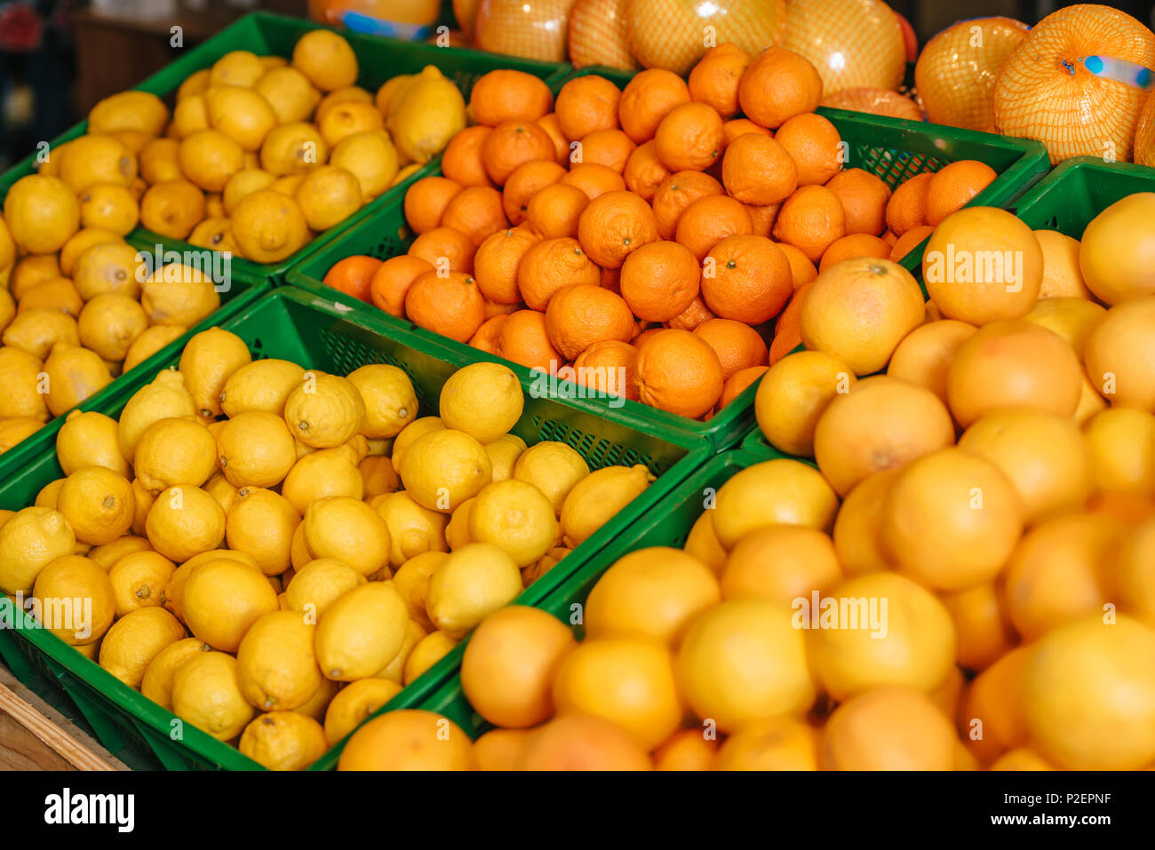 close up view of arranged citrus fruits in grocery shop Stock Photo - Alamy