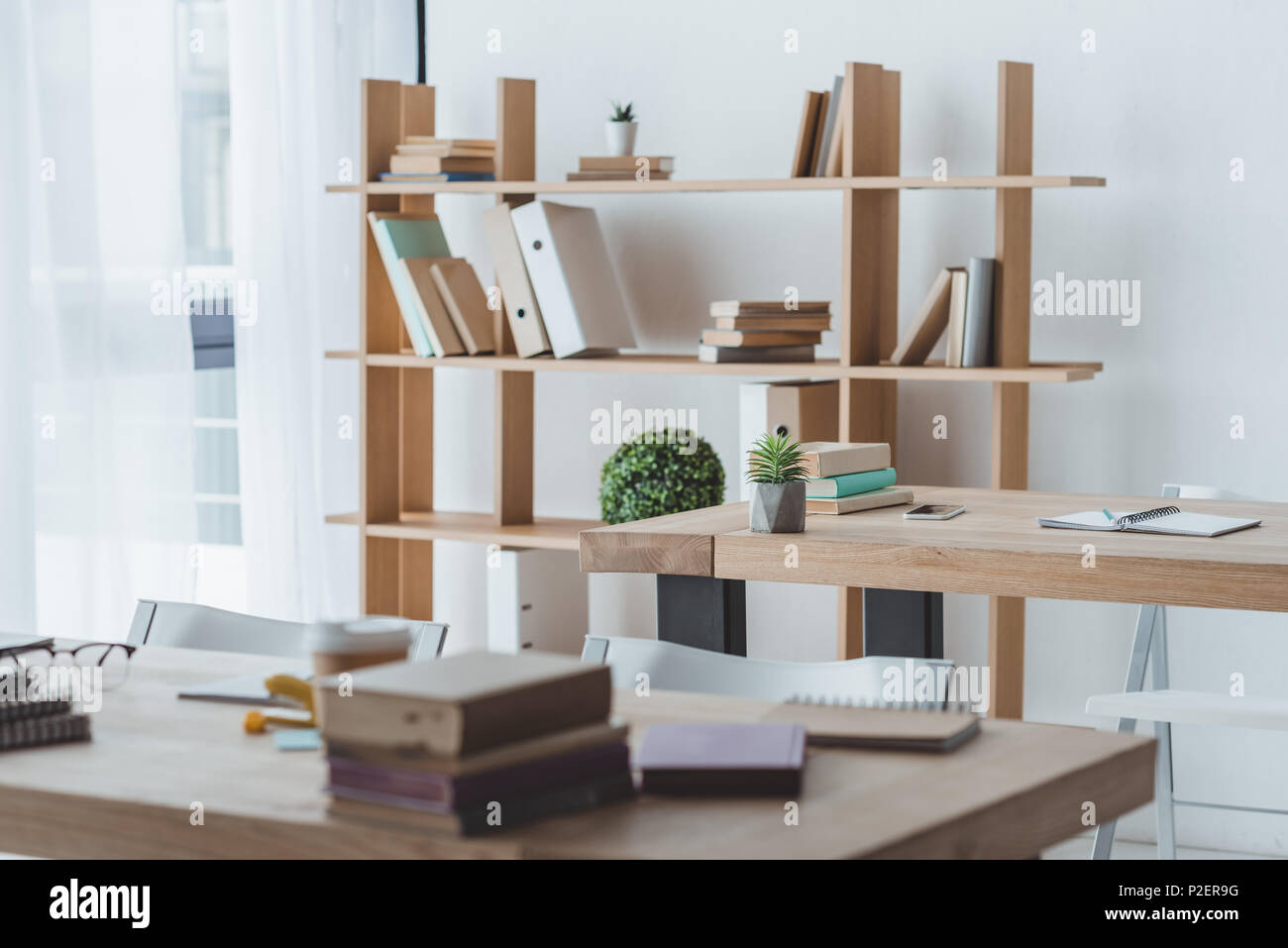 classroom interior with shelf and books on tables Stock Photo - Alamy