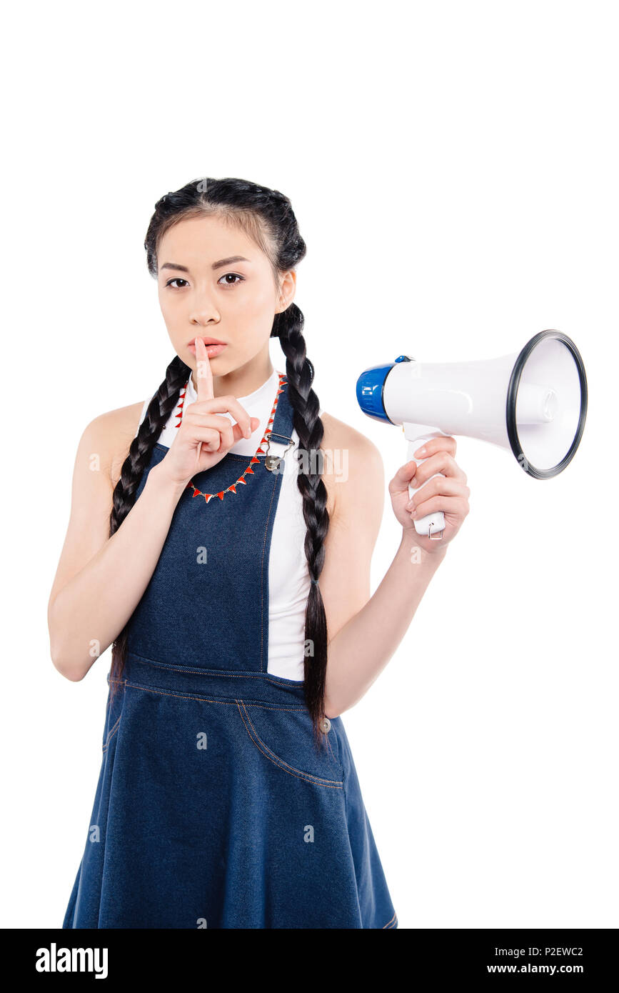 portrait of asian woman with loudspeaker showing silence sign isolated ...