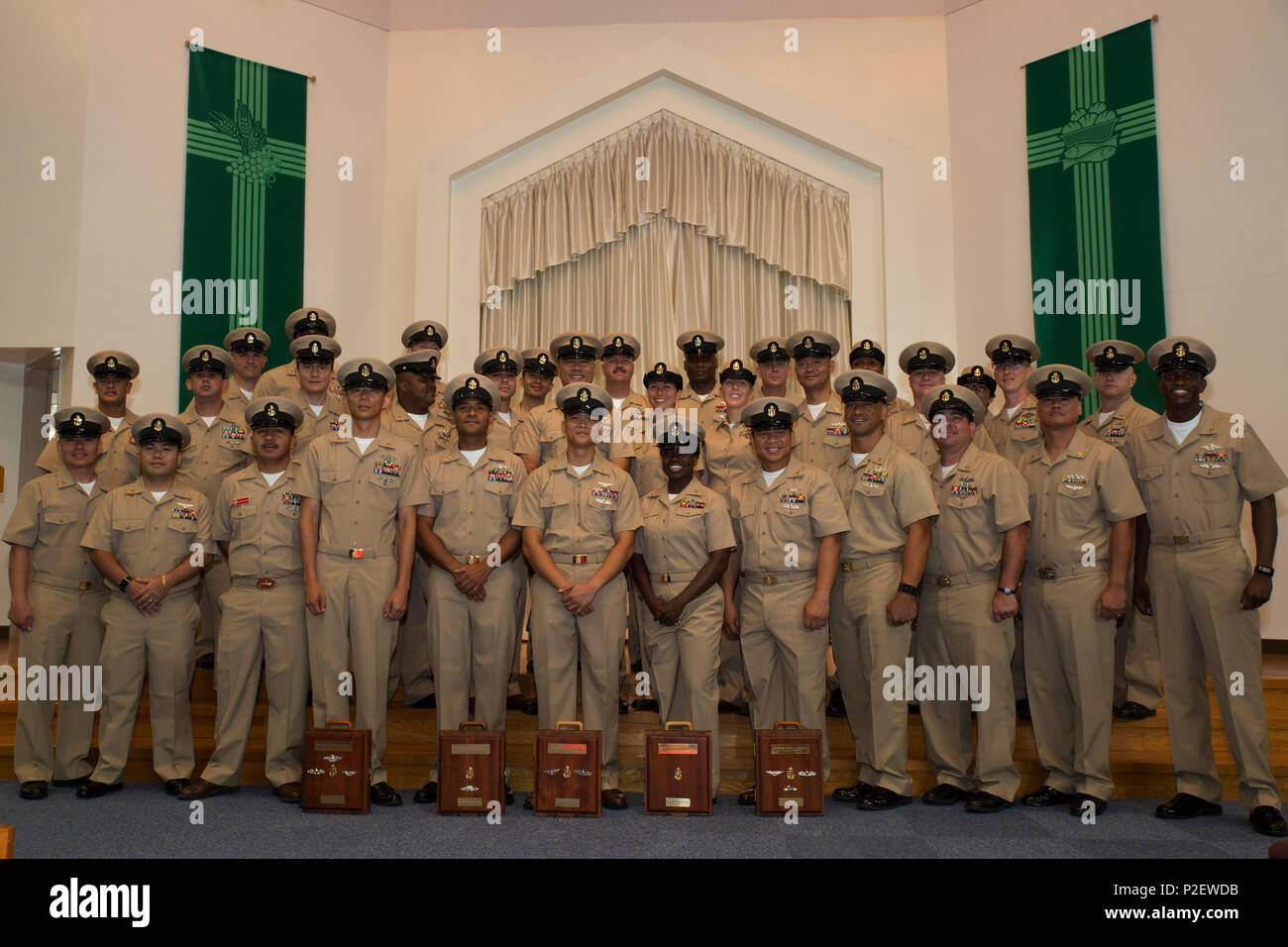U.S. Navy Sailors pose for a group photo during a promotion ceremony in ...