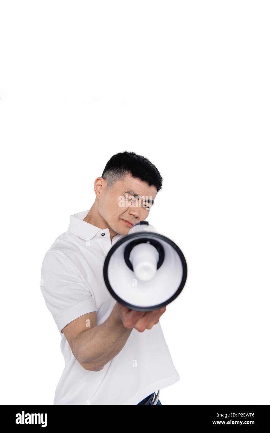 portrait of asian man pointing at camera with bullhorn isolated on ...