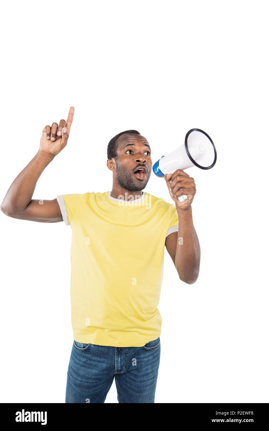 portrait of excited african american man with bullhorn pointing up ...