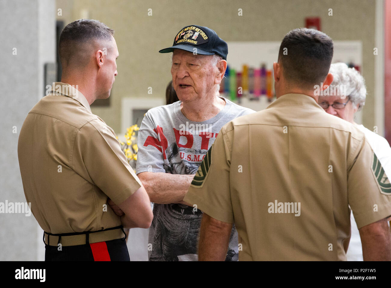 R.H. “Pete” Barnes (Ret. U.S. Marine), left, speaks with U.S. Marines ...