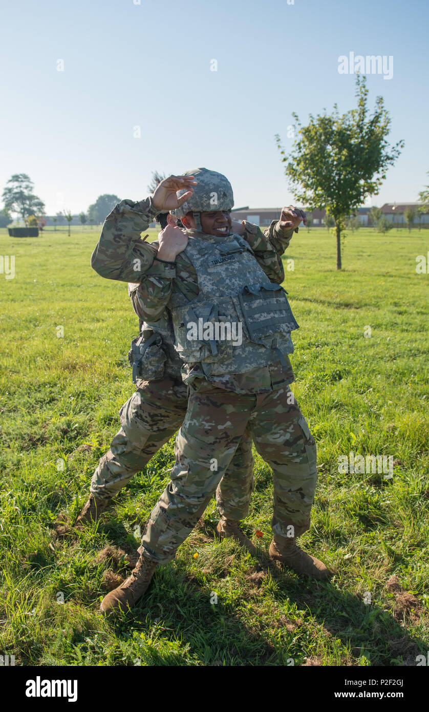 U.S. Army Sgt. Jerrell Knight performs a transition to the back on Sgt ...