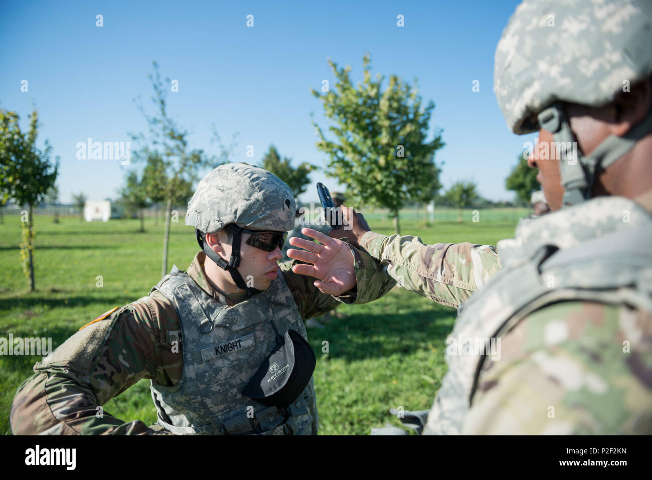 U.S. Army Sgt. Jerrell Knight, with 128th Signal Company, pushes away ...