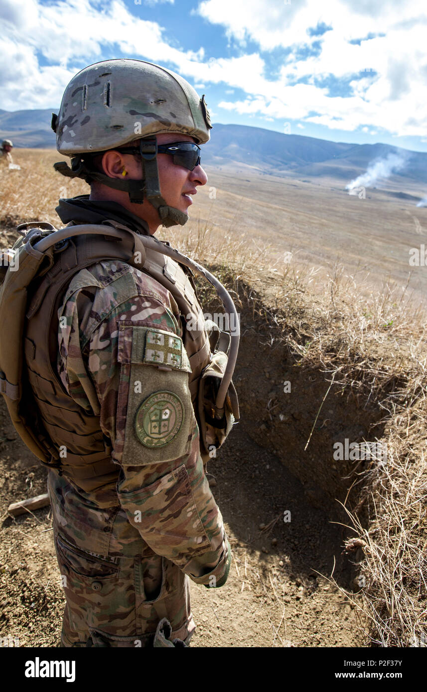 A Georgian soldier observes the landscape after synchronizing his anti ...
