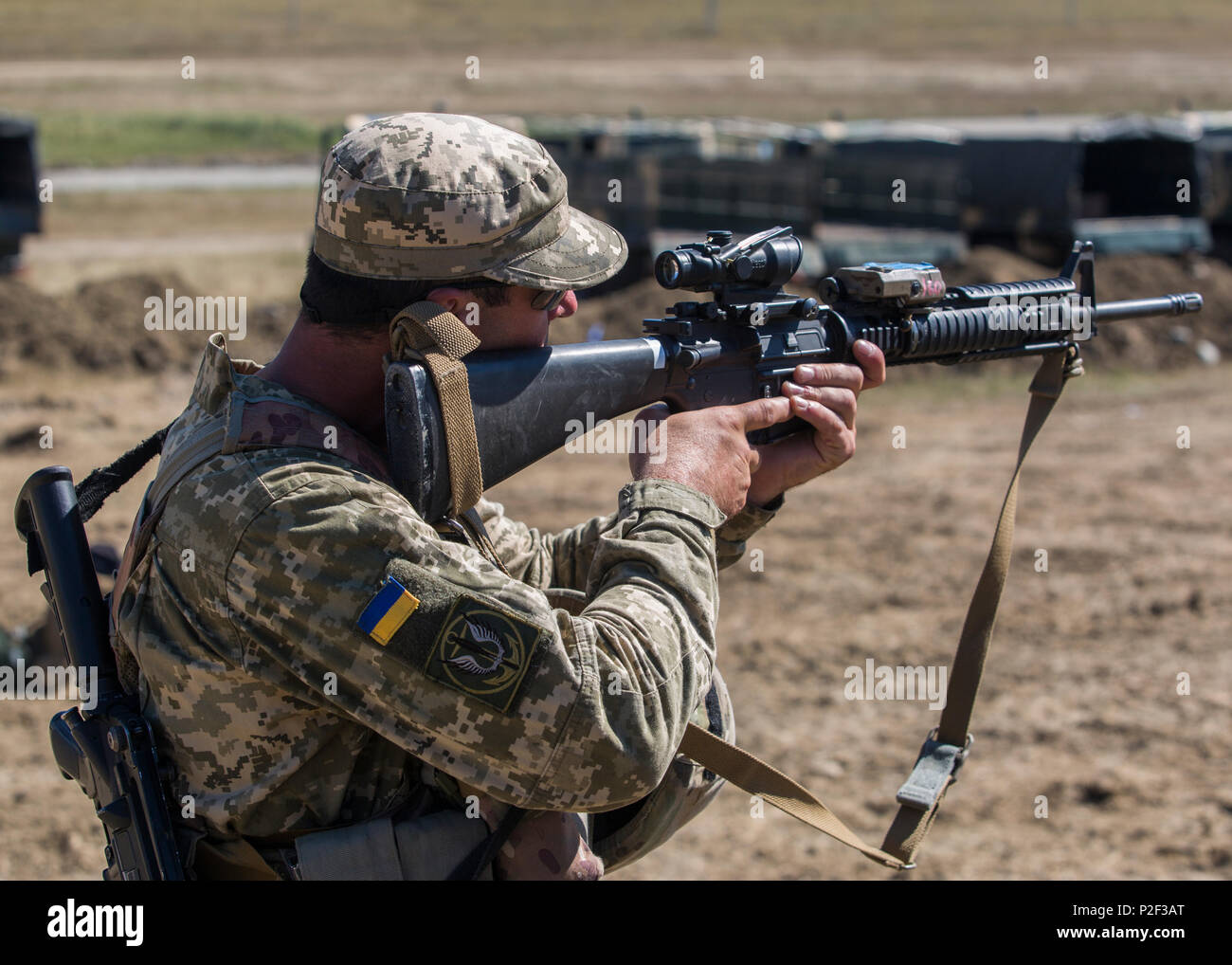 A Ukrainian military member examines an M16A4 belonging to a U.S ...