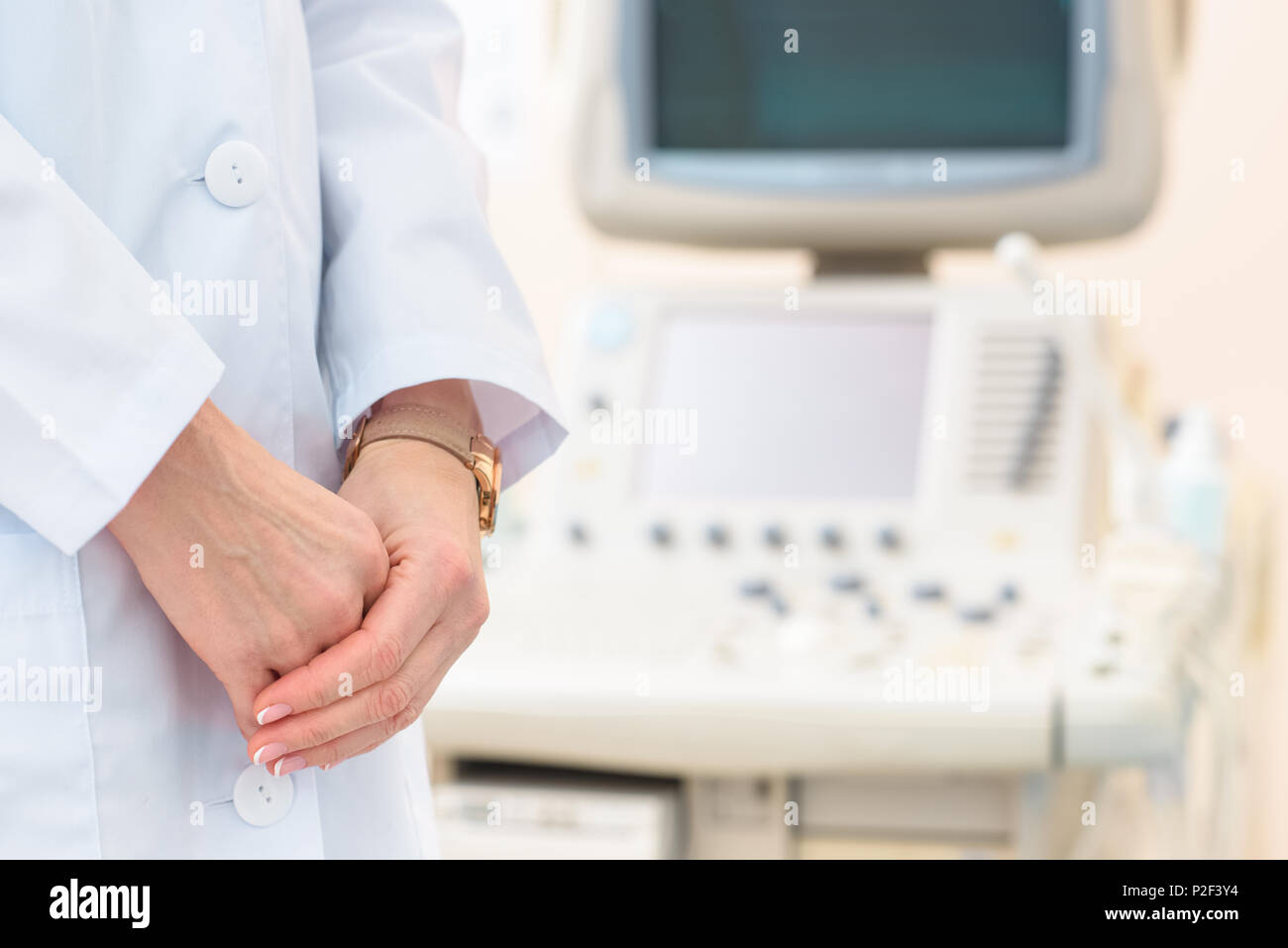 Close-up shot of obstetrician gynecologist performing Doppler ...