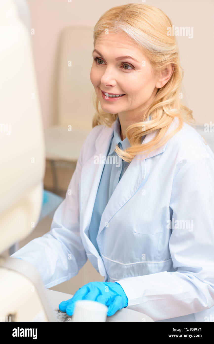 happy obstetrician gynecologist working with ultrasonic scanner Stock ...