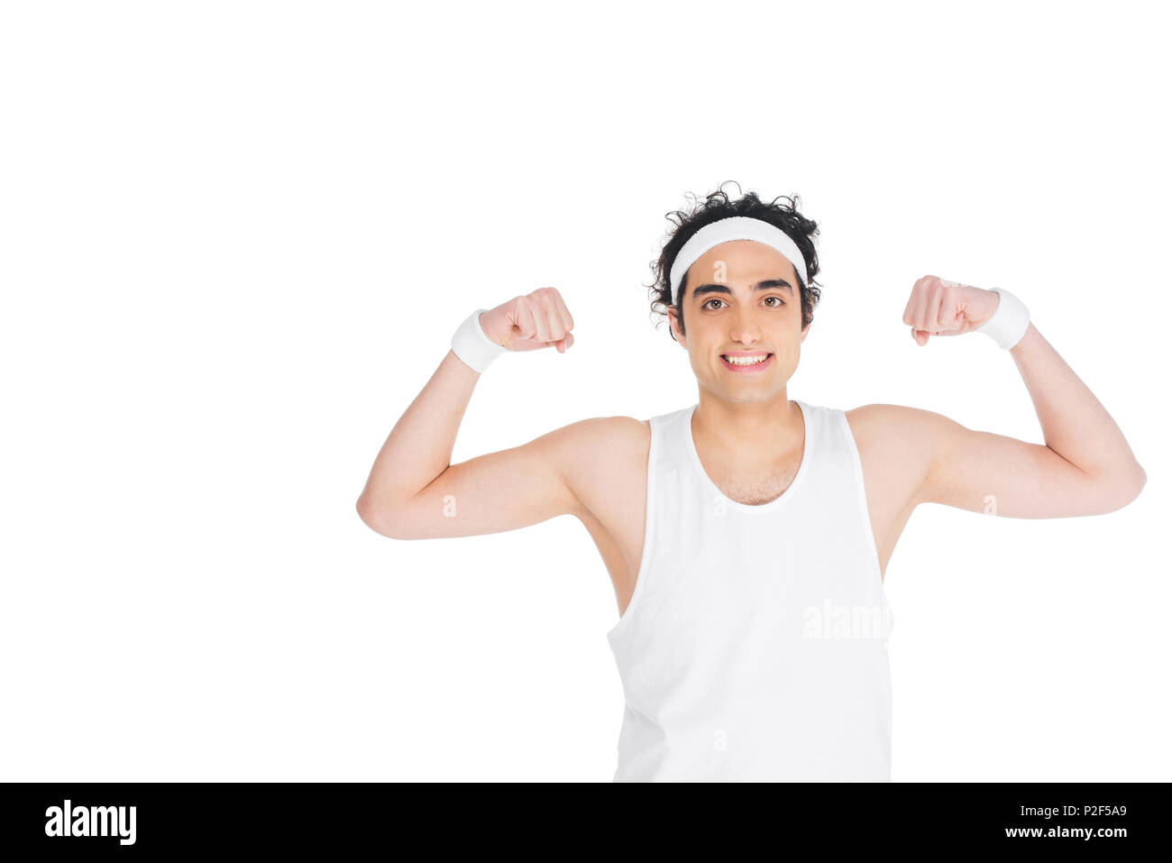 Young thin man in singlet showing muscles isolated on white Stock Photo ...