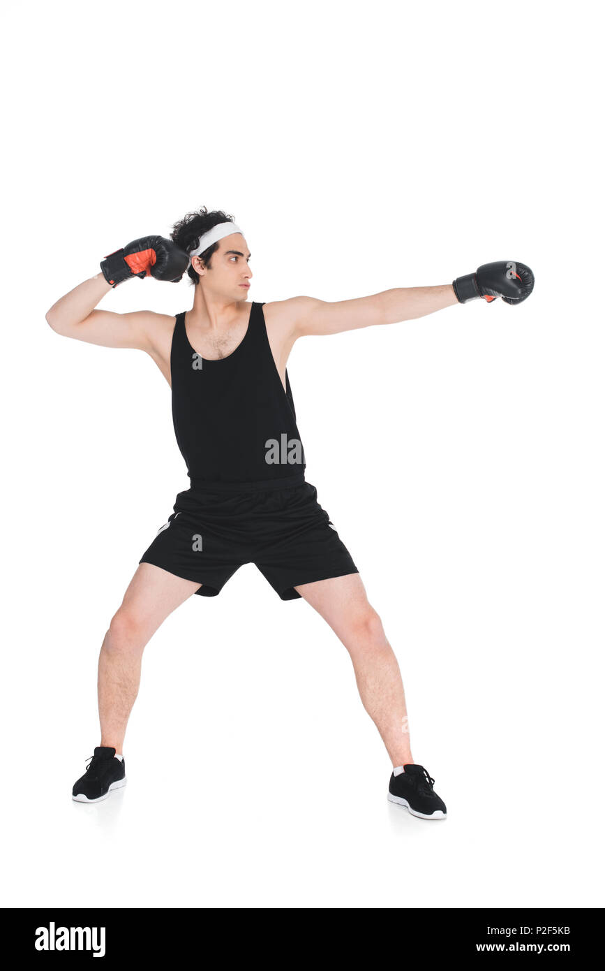 Side view of skinny young boxer preparing to hit isolated on white ...