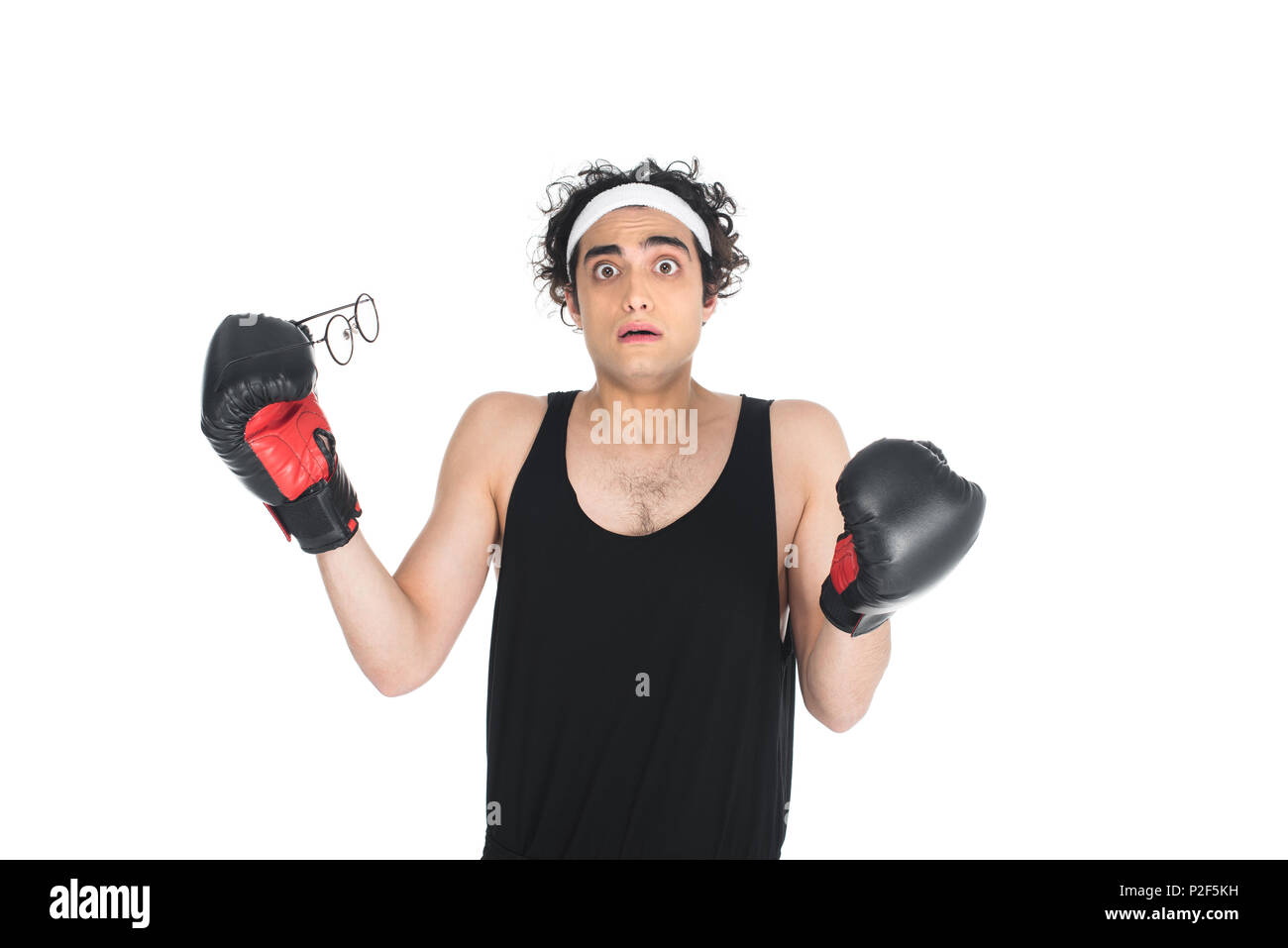 Shocked thin young boxer taking off eyeglasses isolated on white Stock ...