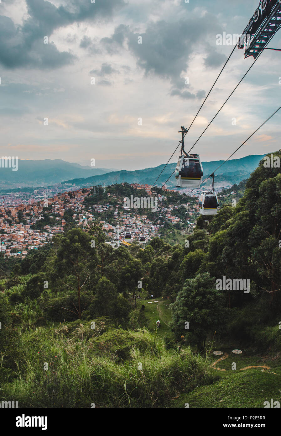 Teleferico cable cars climb over the mountains of Medellin, Colombia ...