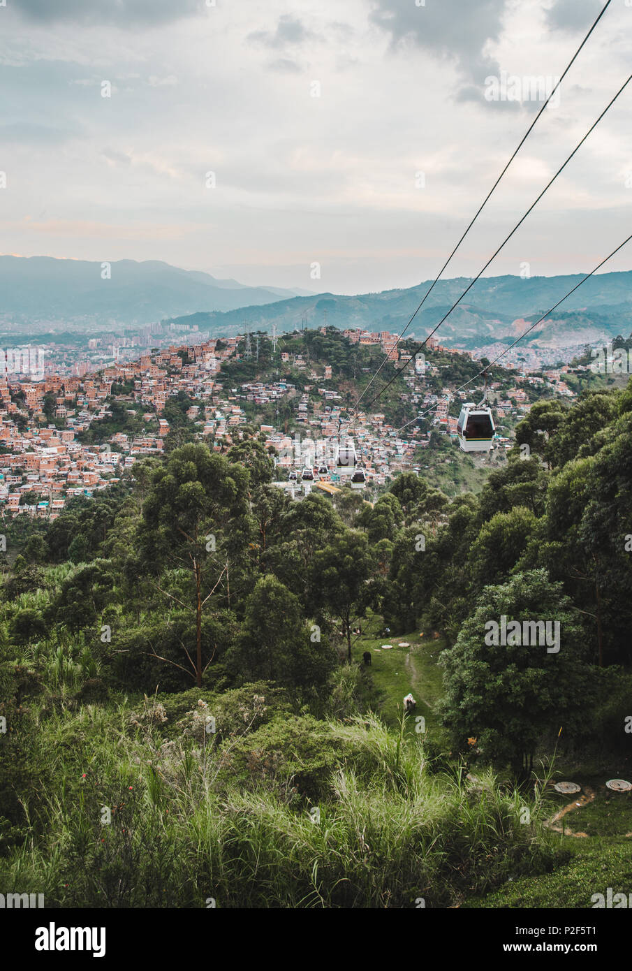 Teleferico cable cars climb over the mountains of Medellin, Colombia ...