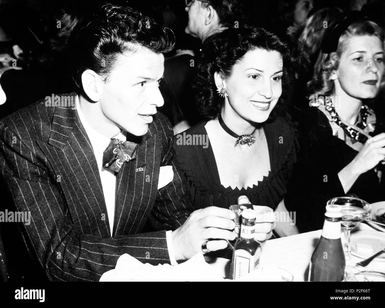 Description: Frank Sinatra and his wif e Nancy at a night club.. Stars ...