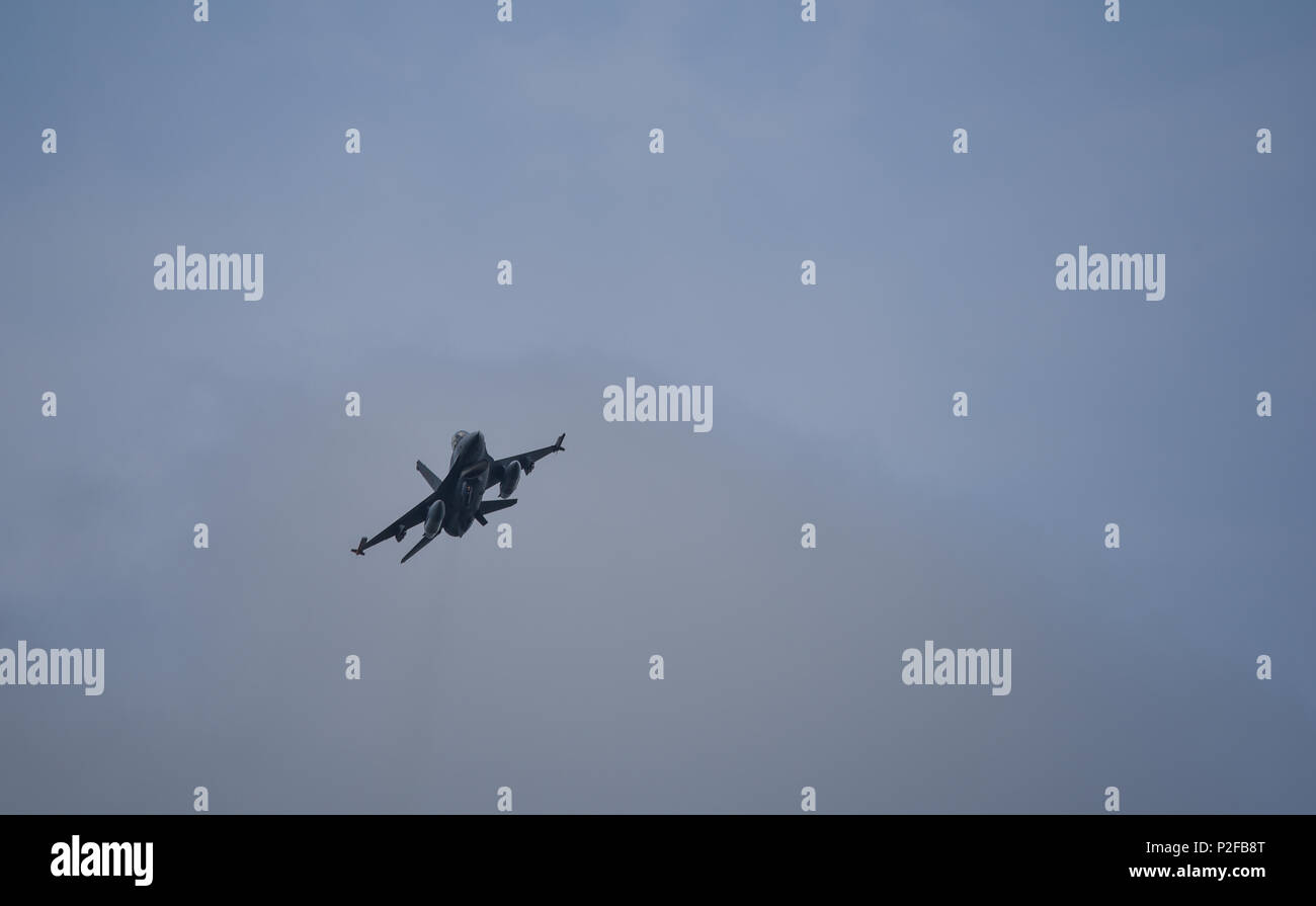 A Belgian Air Force pilot conducts a training flight in an F-16 ...