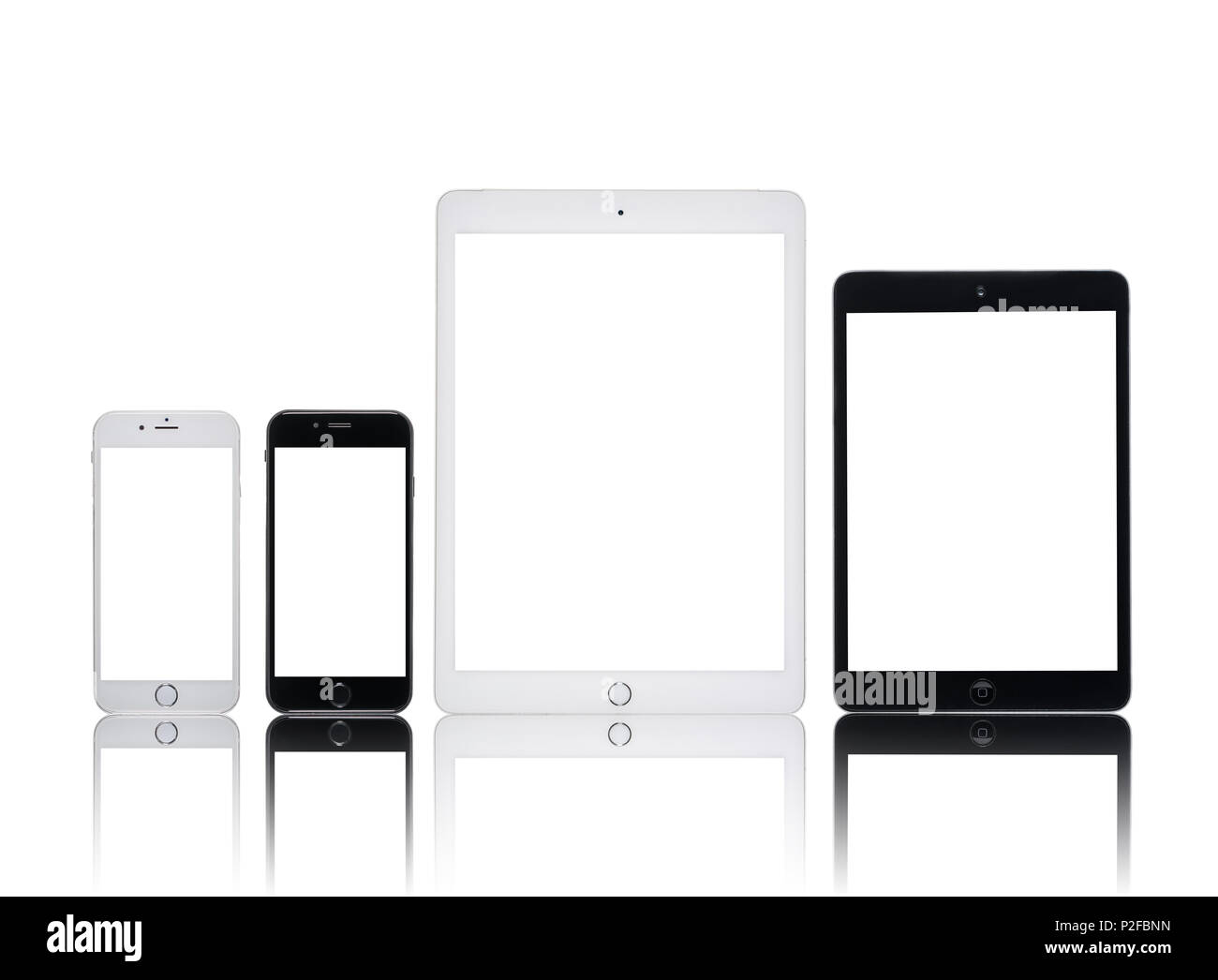 close up view of digital tablets and smartphones isolated on white ...